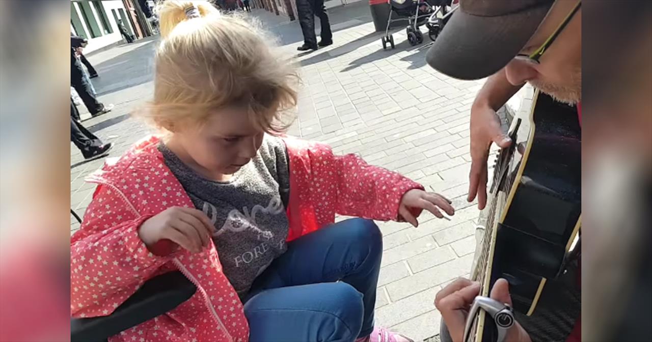 7-Year-Old Blind Girl With Autism Finds Joy In Street Busker's Music